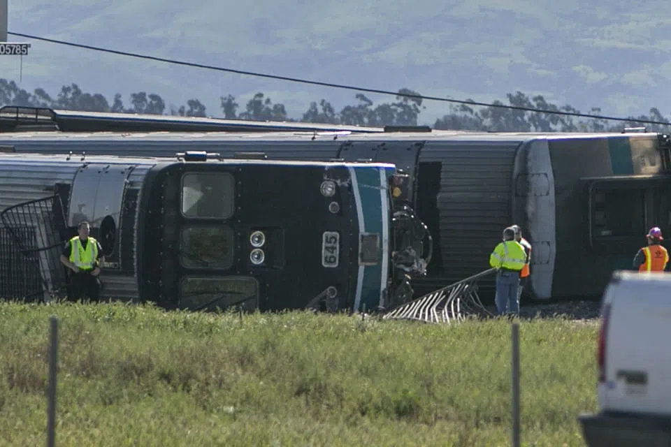 Dozens injured as train hits truck stuck at rail crossing in US