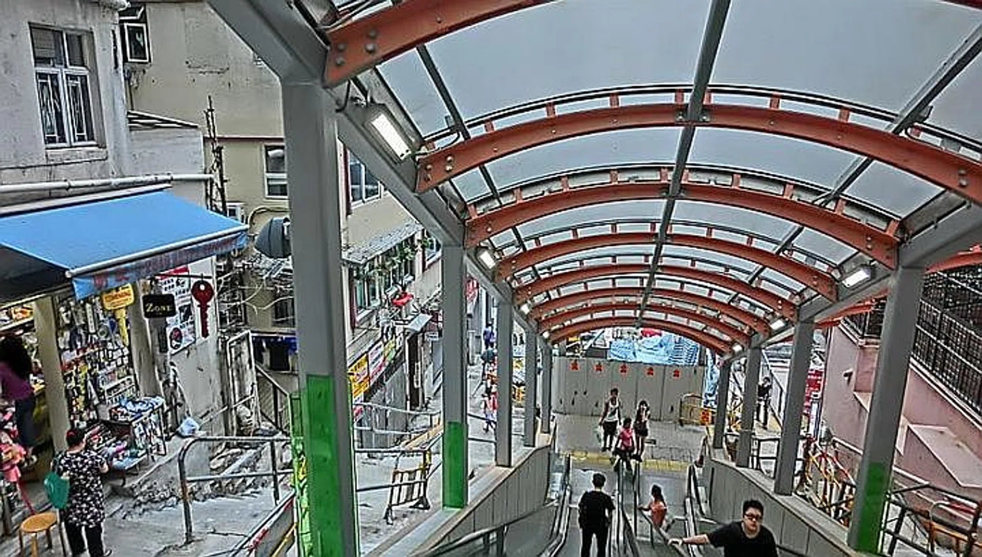 Escalator sounds death knell for small HK shops - The Business Times