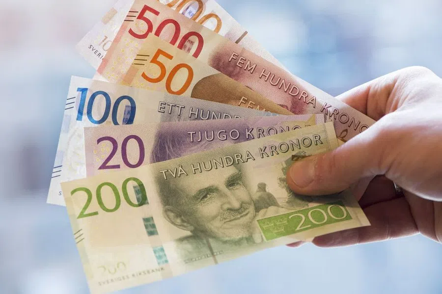 Swedish krona gains on central bank forecast for more hikes, US dollar ...