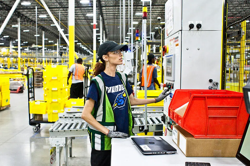 Amazon workers find new roles as robots take over the heavy lifting
