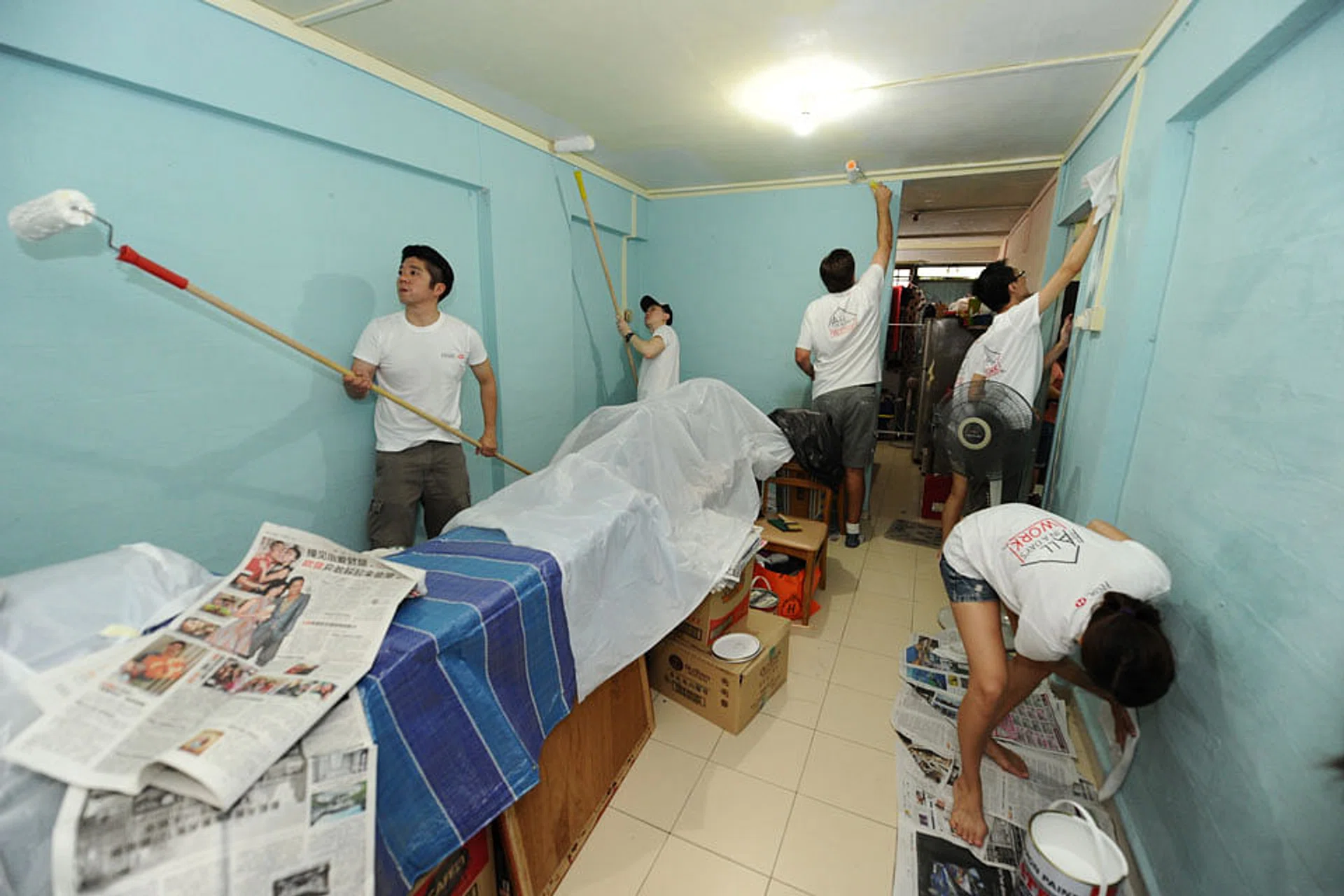 HSBC volunteers spiff up homes of 245 families - The Business Times