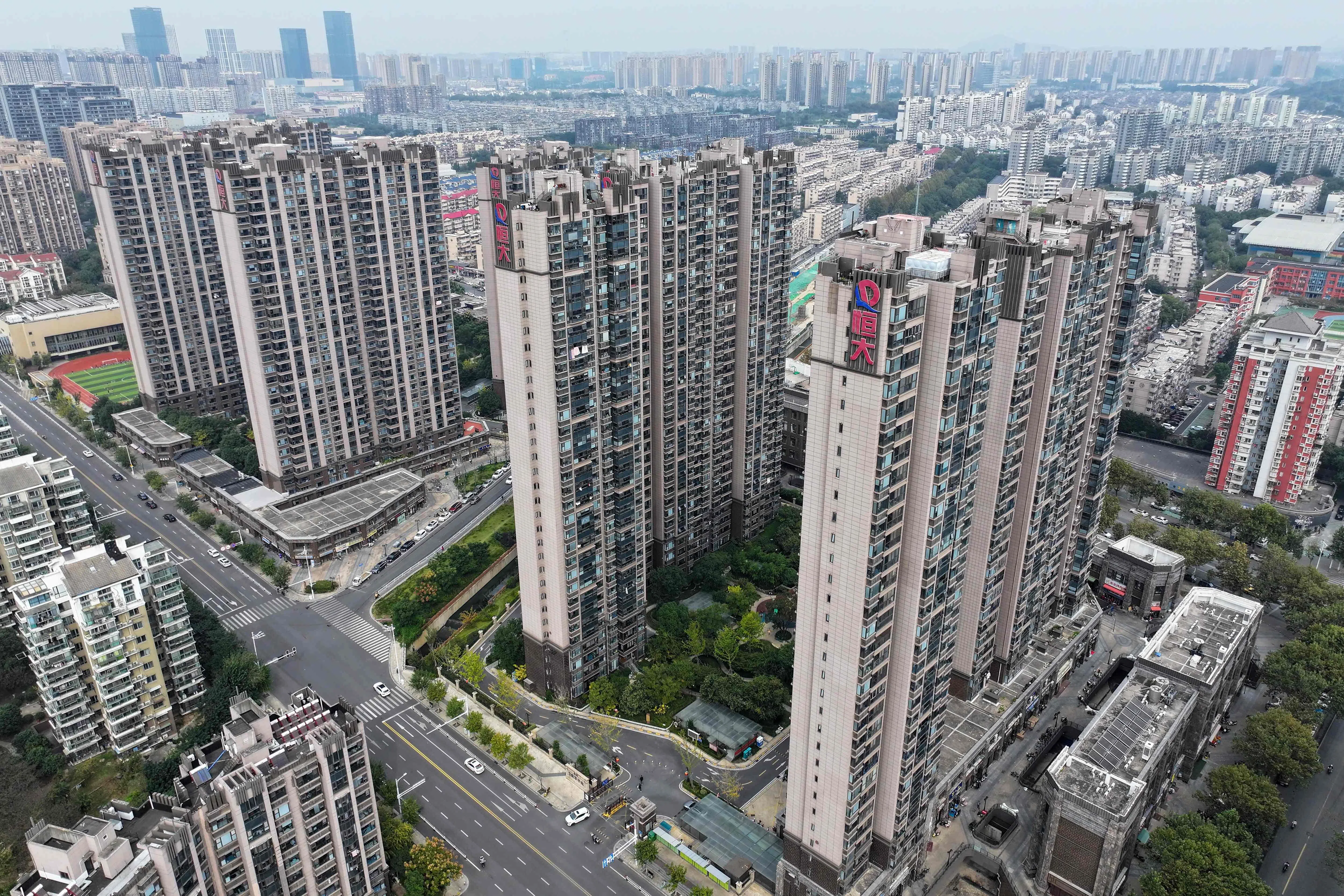 China official vows to prevent collective defaults of developers - The ...