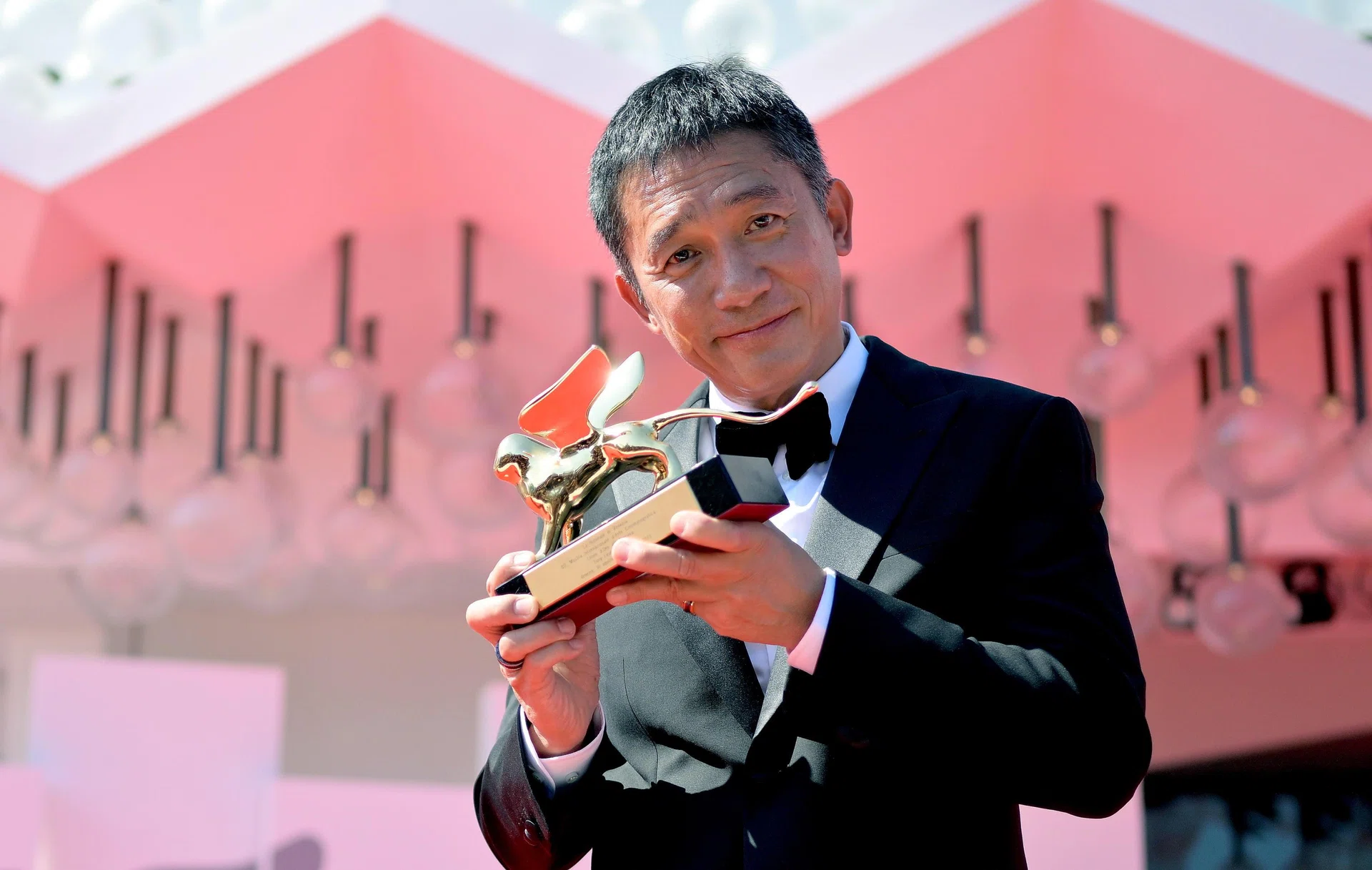Emotional Tony Leung wins lifetime award at Venice - The Business Times