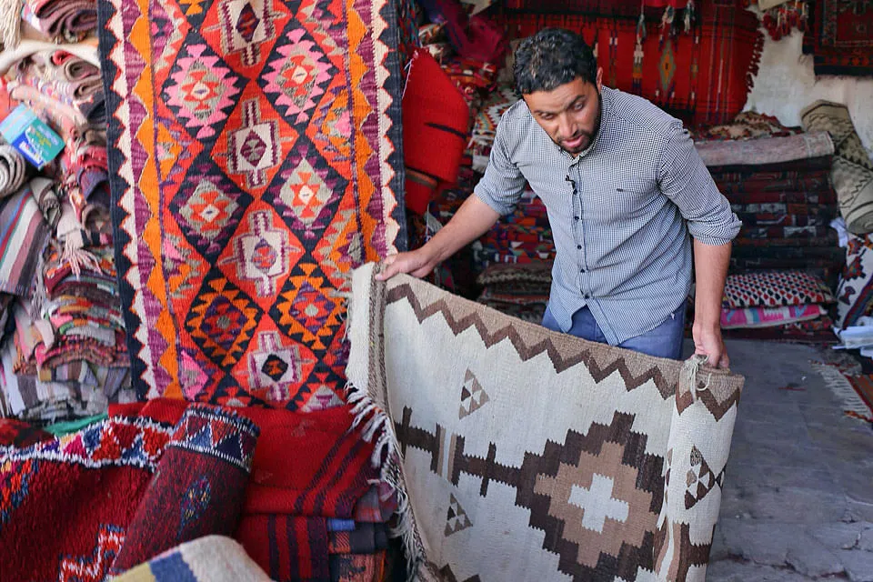 Traditional carpet weaving in central Iraq unravels