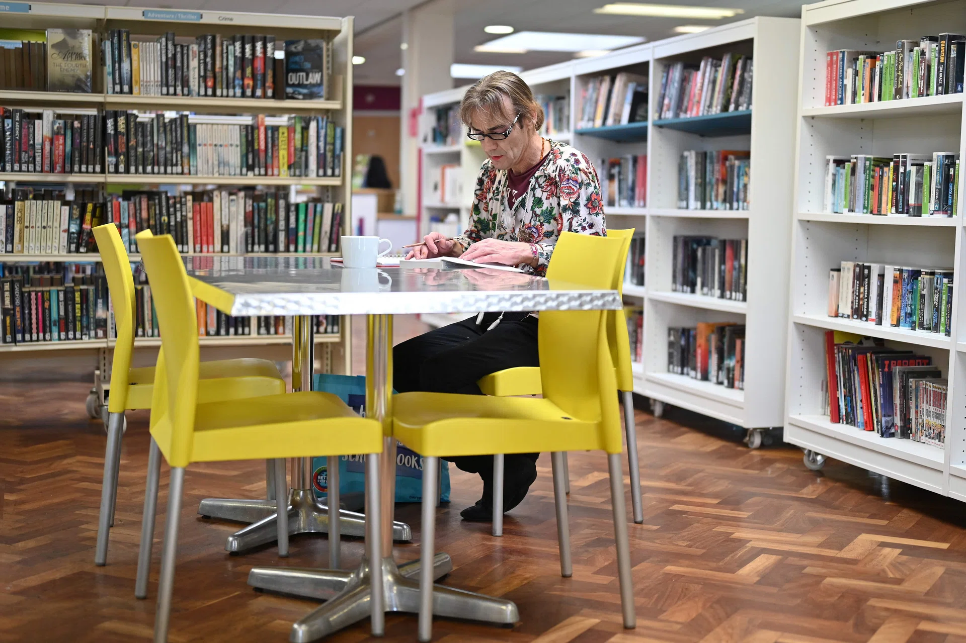 Libraries offer novel 'warm space' for hard-up Britons - The Business Times