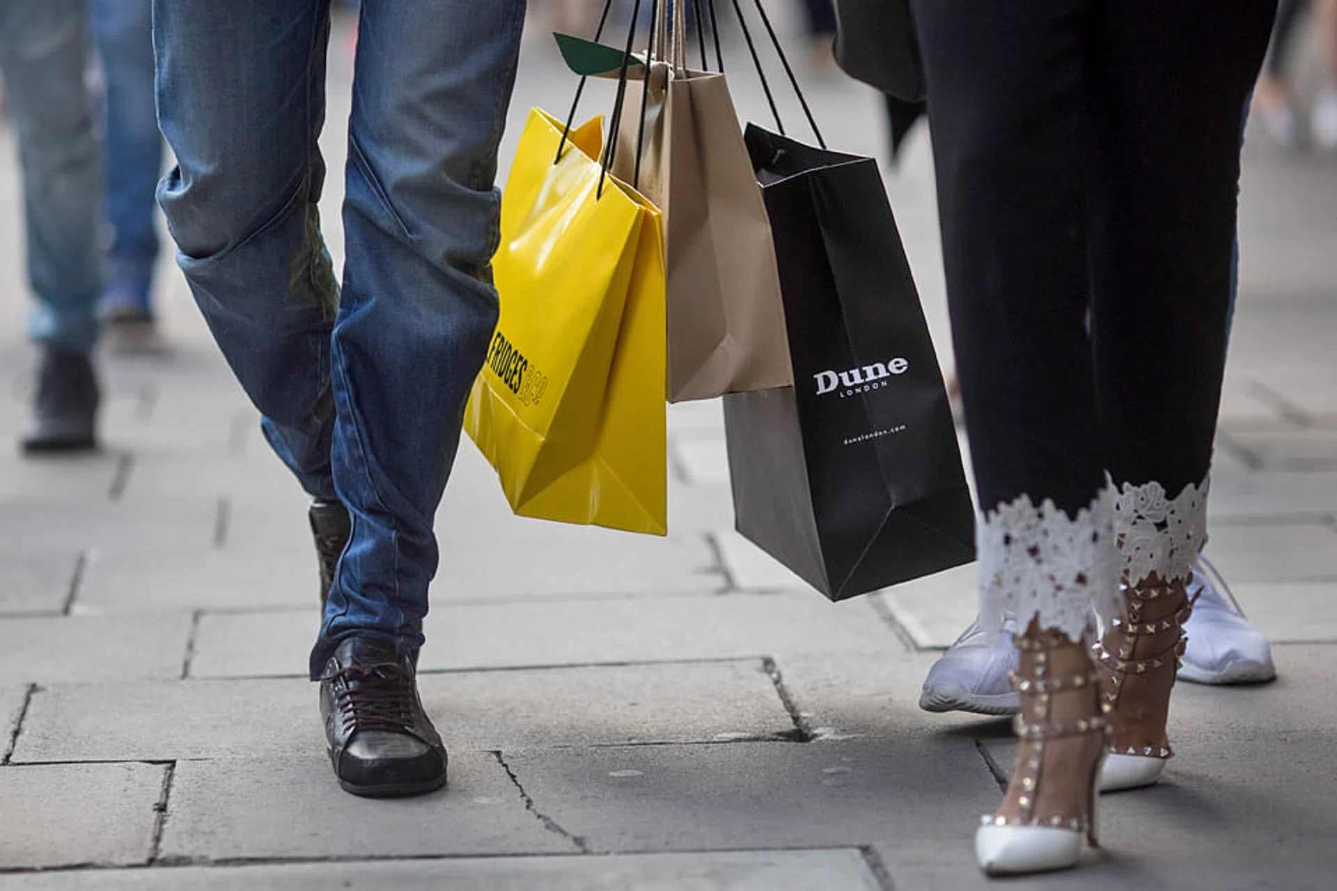 UK consumers spend more in August, but pinch persists - The Business Times