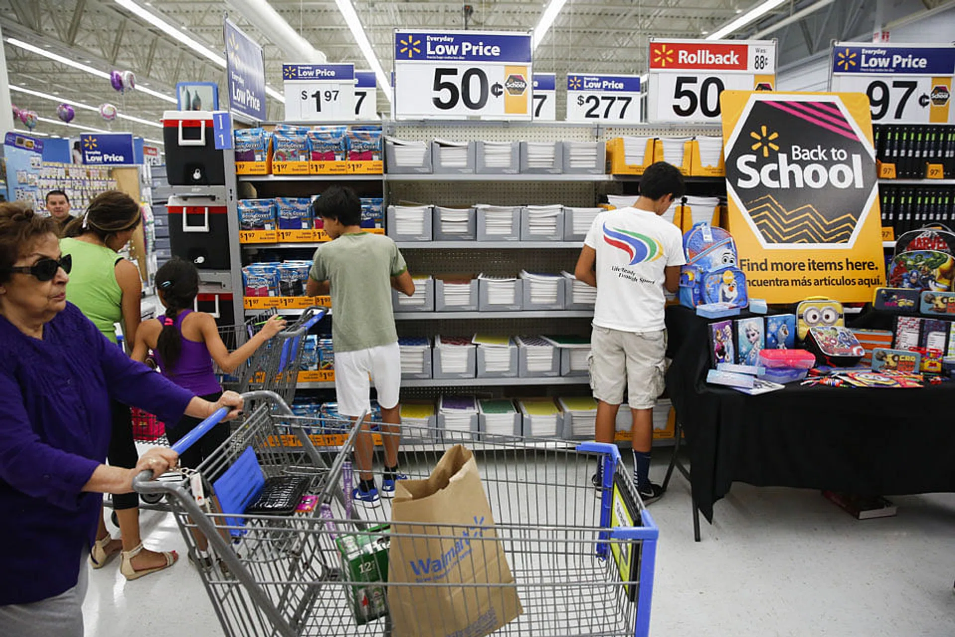 Walmart cuts profit outlook on higher wages - The Business Times